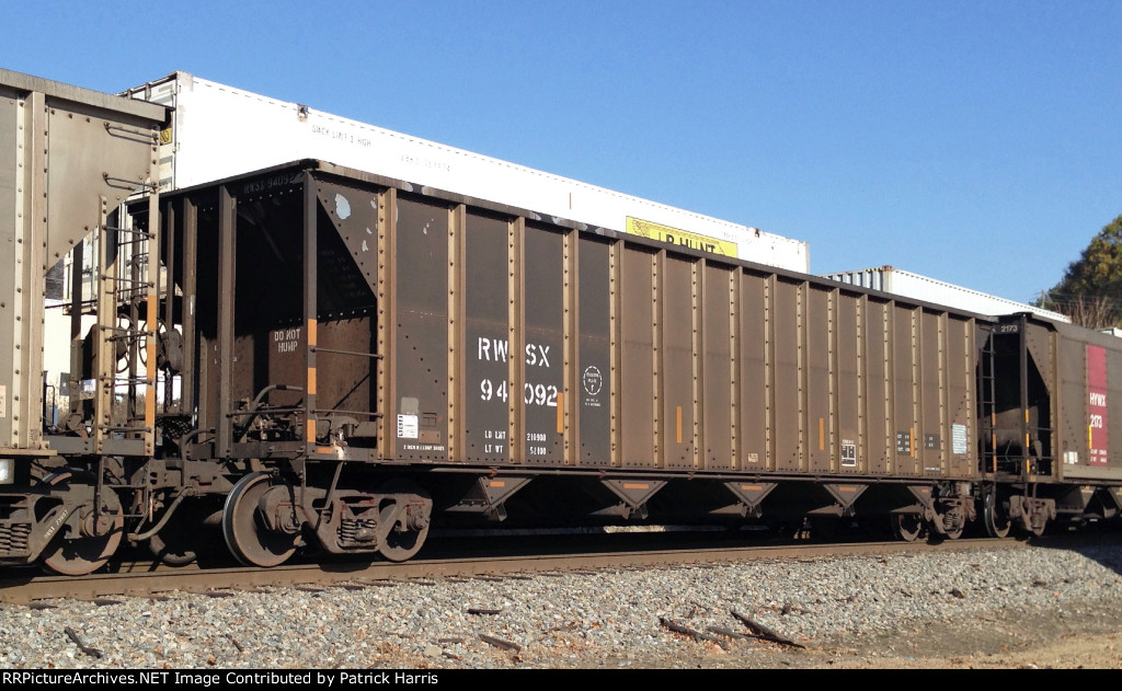 RWSX 94092 empty Georgia Power 5-bay aluminum coal hopper in a BNSF wesbound on the NS through ...